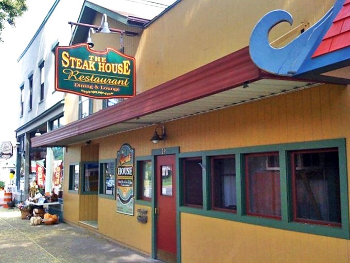 The unassuming yellow exterior hides culinary treasures within, like finding Batman's cave disguised as a suburban home in Wellsboro.