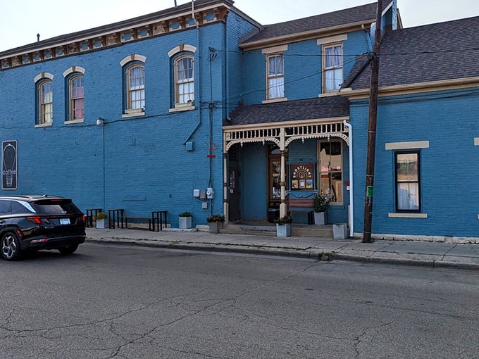 The blue Victorian facade of Ghostlight Coffee isn't just eye-catching&mdash;it's a promise that what awaits inside isn't your average caffeine pit stop.