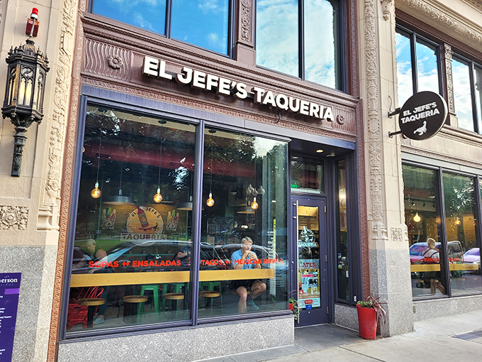 El Jefe's Taqueria nestles into Boston's historic architecture, its black circular sign beckoning hungry explorers like a taco lighthouse in a sea of brick and granite.