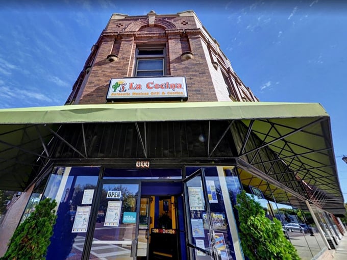 La Cocina's unassuming brick exterior with its cheerful green awning stands as Seward's culinary beacon, promising Mexican treasures within.