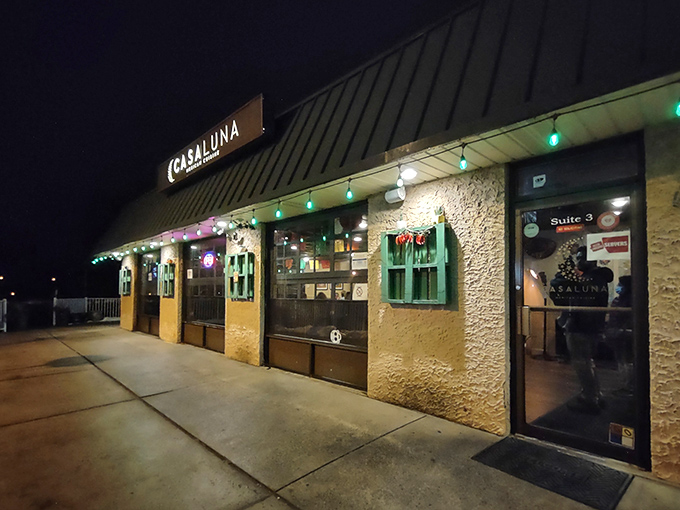 The welcoming patio at Casa Luna beckons like a culinary oasis in Somerville, where vibrant umbrellas and sunflowers promise Mexican delights inside.