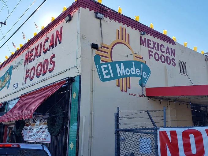 The unassuming turquoise and white facade of El Modelo stands like a culinary lighthouse in Albuquerque's Barelas neighborhood, beckoning hungry souls for generations.