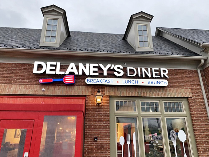 The brick exterior with those eye-catching red doors practically screams "good food inside!" Delaney's Diner stands out without trying too hard.