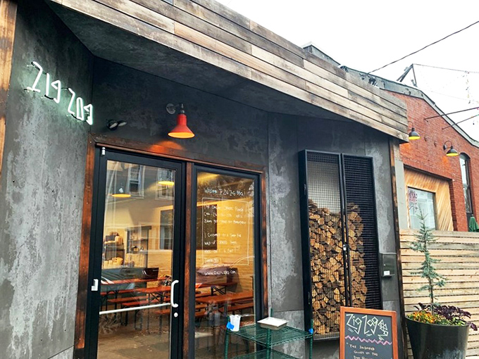 The industrial-chic exterior with its caged firewood display isn't just Instagram bait&mdash;it's a smoky promise of what awaits inside. Meat destiny calls. 