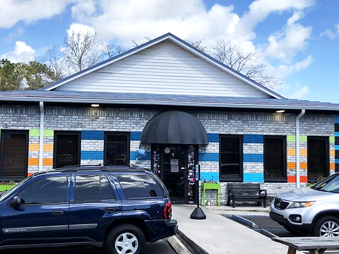 The colorful exterior of Early Bird Diner stands out like a beach umbrella in winter, promising a dining experience as vibrant as its paint job. 
