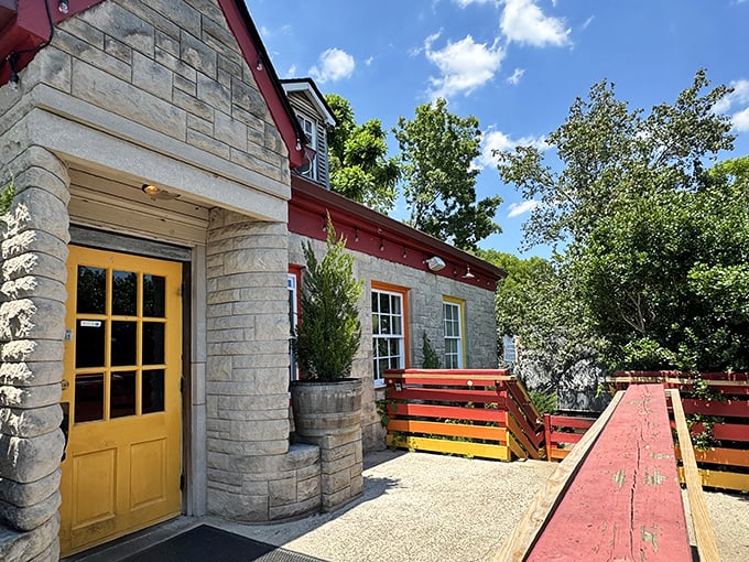 El Fuego's stone exterior with vibrant red trim stands out like a culinary lighthouse, beckoning hungry travelers with promises of authentic Mexican flavors.
