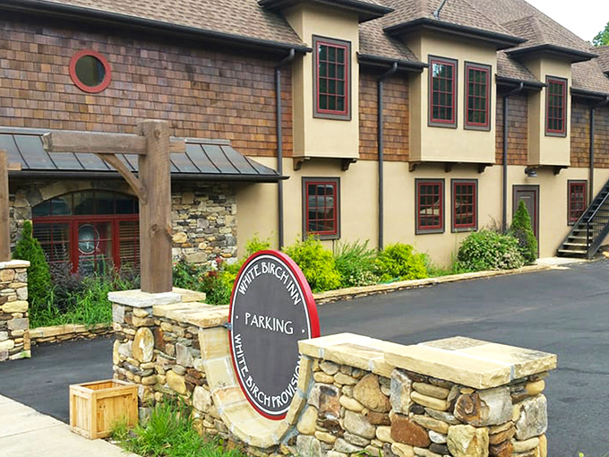 Storybook charm meets serious coffee credentials at White Birch Provisions. The stone-and-cedar shake exterior with those whimsical round windows practically whispers, "Come inside, the coffee's extraordinary."