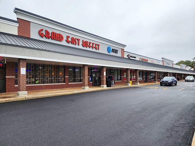 The bold red lettering of Grand East Buffet beckons hungry patrons like a lighthouse guiding ships to harbor. This unassuming strip mall location houses a treasure trove of culinary delights.