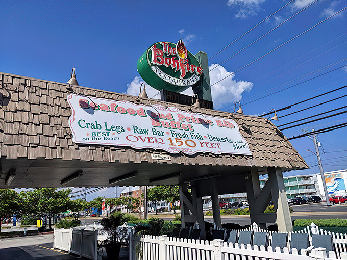 The iconic green Bonfire sign beckons hungry travelers like a lighthouse for seafood lovers on Ocean City's Coastal Highway.