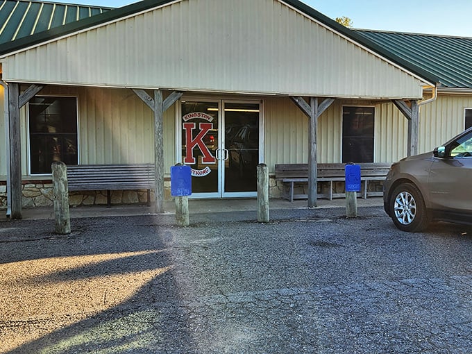 The unassuming exterior of BG's Catch stands like a beacon for hungry travelers, with its iconic fish sign promising seafood salvation in Kingston.