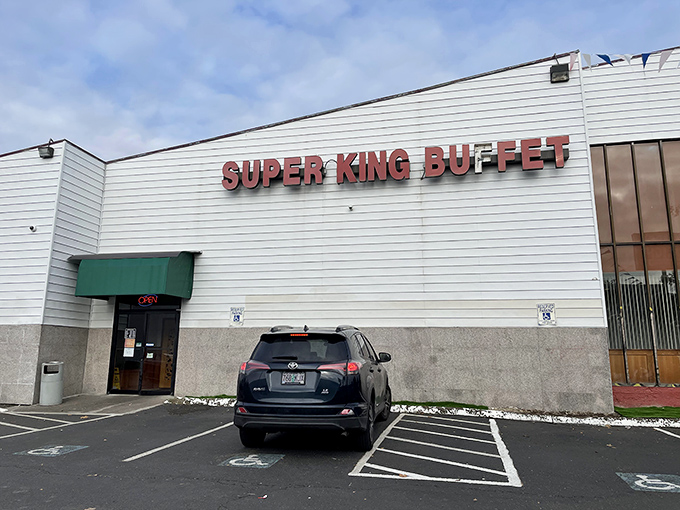The unassuming exterior of Super King Buffet stands like a culinary fortress, promising treasures within that the modest fa&ccedil;ade cleverly conceals from passing traffic. 