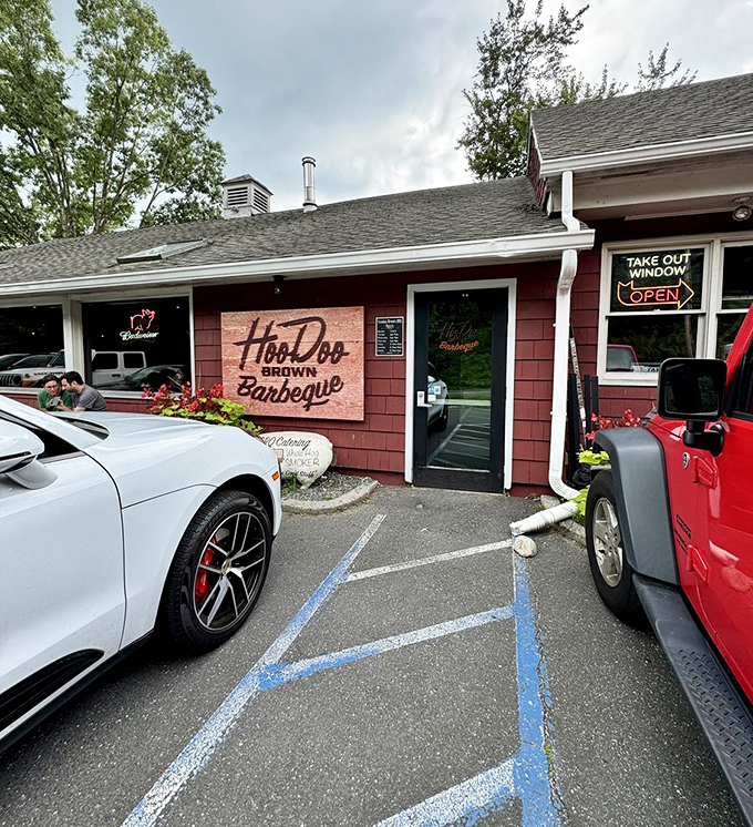The unassuming red exterior hides barbecue greatness like Clark Kent's glasses hide Superman. That "OPEN" sign is your beacon to smoky paradise.