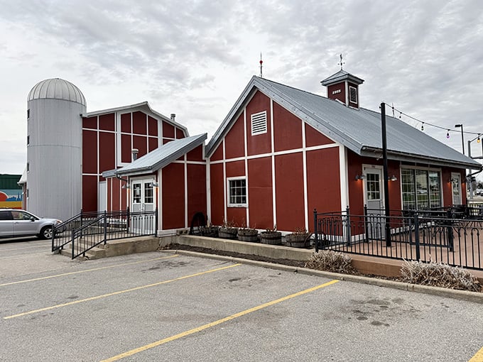 The red barn-like structure with its silo isn't just architectural flair&mdash;it's a beacon calling hungry travelers home to barbecue paradise.