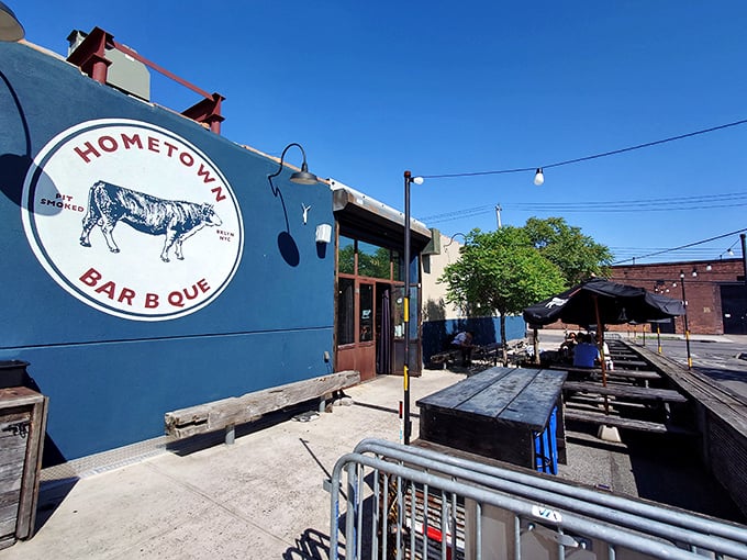 The blue exterior with its vintage cow logo isn't just a restaurant front&mdash;it's a beacon of smoke-scented hope for barbecue pilgrims seeking meaty salvation. 
