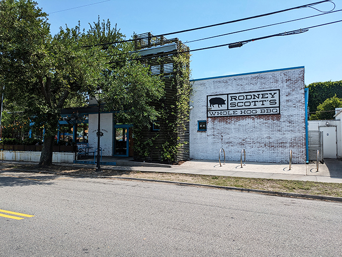The unmistakable white brick and turquoise trim of barbecue paradise. Rodney Scott's exterior promises the smoky delights waiting inside.