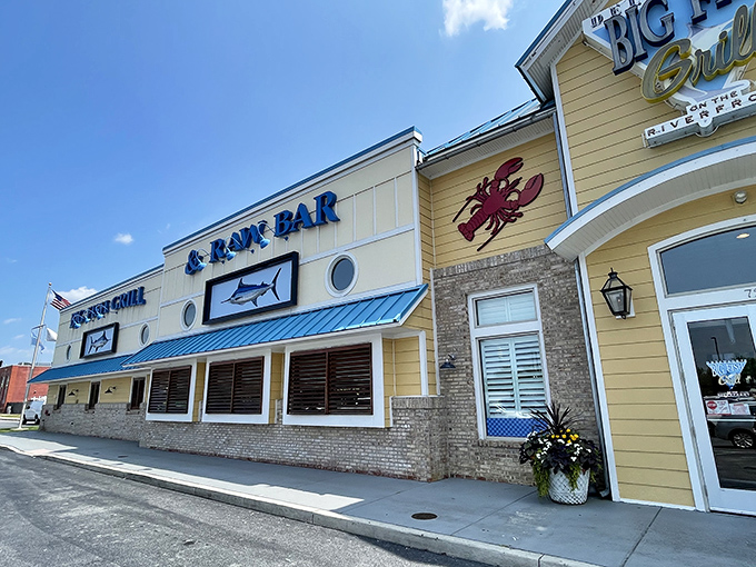 The cheerful yellow exterior of Big Fish Grill stands like a beacon for seafood lovers, promising maritime delights within its nautical-themed walls.
