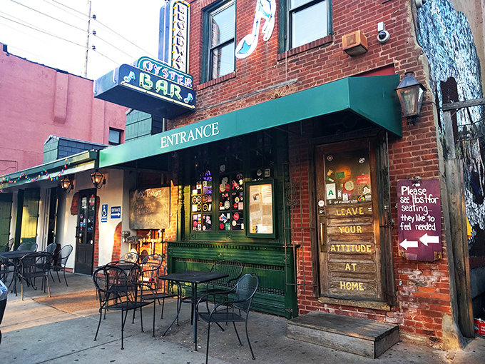 The historic brick facade of Broadway Oyster Bar welcomes seafood lovers with its vibrant green awning and door plastered with memories of good times past.