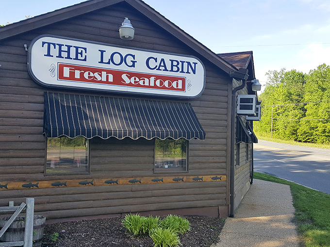 The rustic exterior of The Log Cabin isn't just charming&mdash;it's a promise that what awaits inside is authentic, unpretentious, and deliciously memorable.