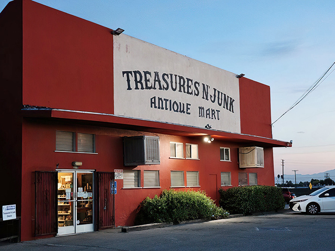 The terracotta fortress of forgotten treasures stands proudly on an Ontario street corner, its weathered sign promising both the sublime and the ridiculous.