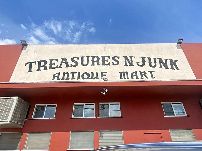The terracotta fortress of forgotten treasures stands proudly on an Ontario street corner, its weathered sign promising both the sublime and the ridiculous.