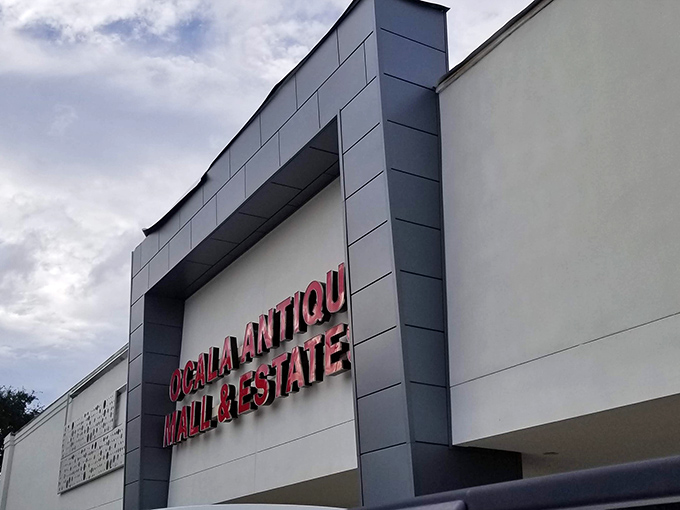 The bright red signage of Ocala Antique Mall beckons treasure hunters like a lighthouse for nostalgia seekers in search of memories.