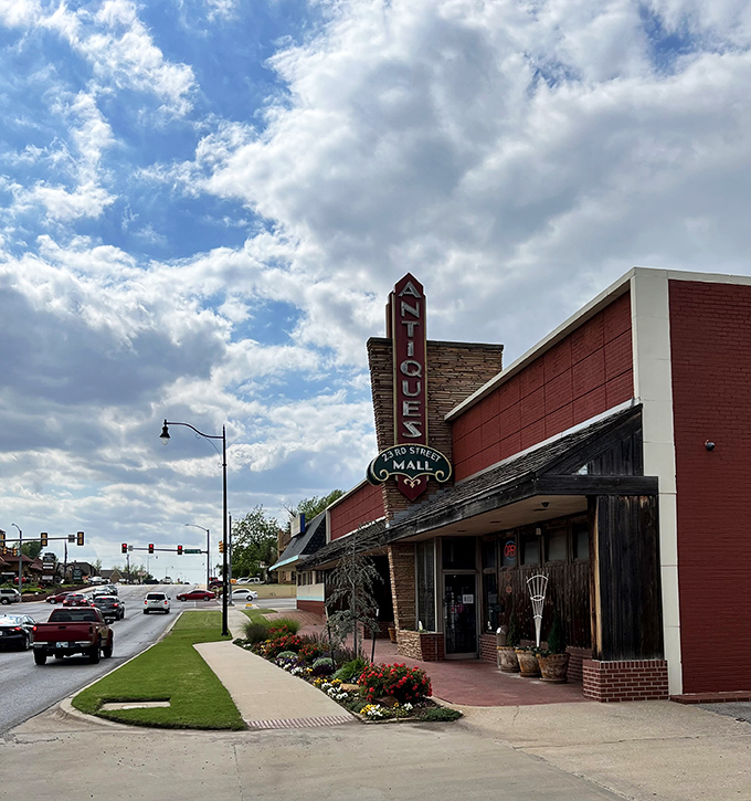 The iconic vintage sign beckons like a time-travel invitation, promising treasures inside this brick building on Oklahoma City's 23rd Street.