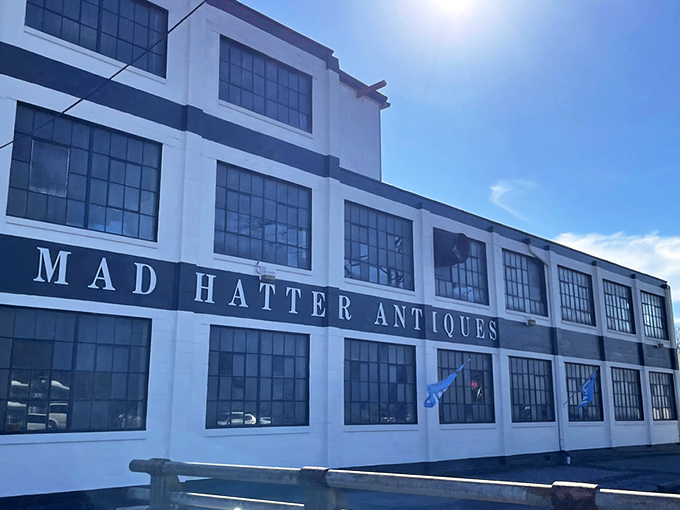 A classic red Volkswagen Beetle parked outside Mad Hatter's striking white facade&mdash;like a cherry on top of this multi-layered sundae of nostalgia. 