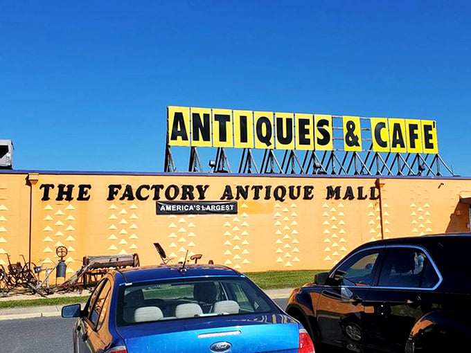 The unmistakable bright orange exterior announces itself like a vintage billboard come to life. America's largest antique mall isn't shy about its superlative status!