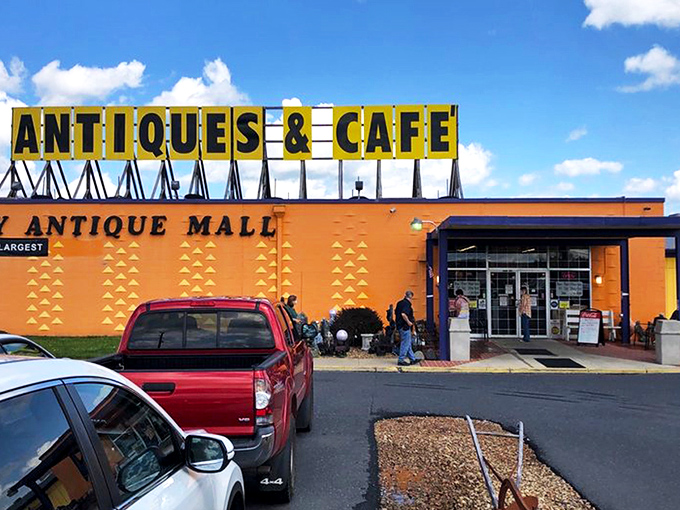 The unmistakable bright orange exterior announces itself like a vintage billboard come to life. America's largest antique mall isn't shy about its superlative status!
