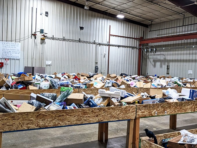 Treasure hunting paradise! Wooden bins stretch across the warehouse floor like archaeological sites waiting to be excavated by bargain-seeking adventurers.