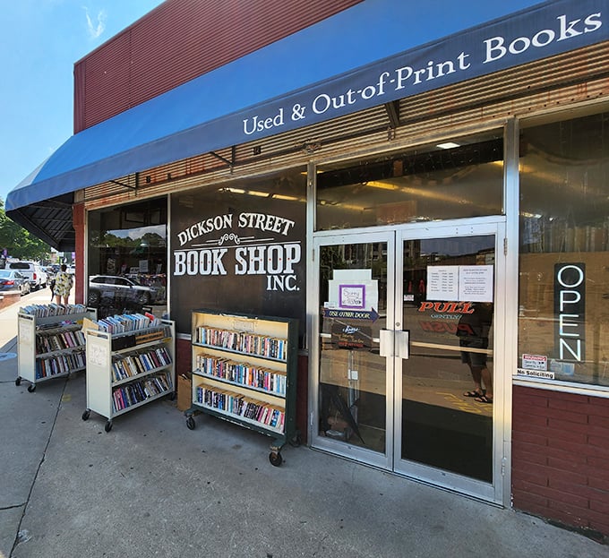 The vibrant red and blue exterior of Dickson Street Bookshop stands like a literary oasis in Fayetteville, promising adventures between covers rather than passport stamps.