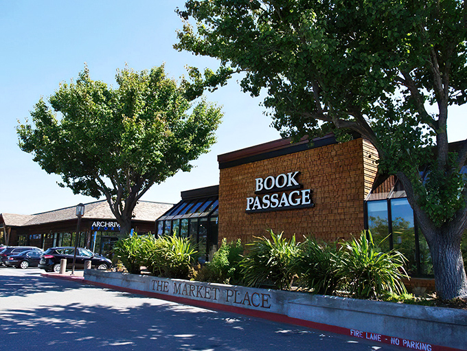 The brick facade of Book Passage beckons like a literary lighthouse, promising safe harbor for readers adrift in a sea of mediocre entertainment options.