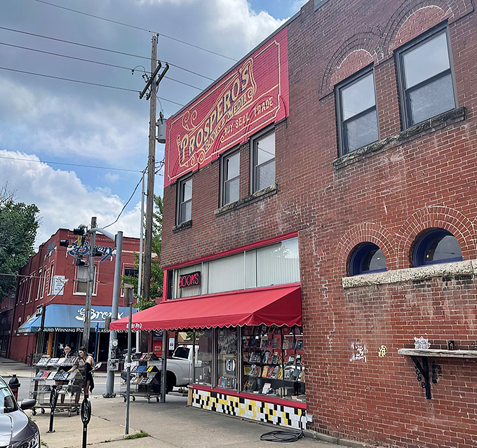 The iconic red and gold sign of Prospero's Books beckons bibliophiles like a literary lighthouse on 39th Street. Books, media, and endless possibilities await.