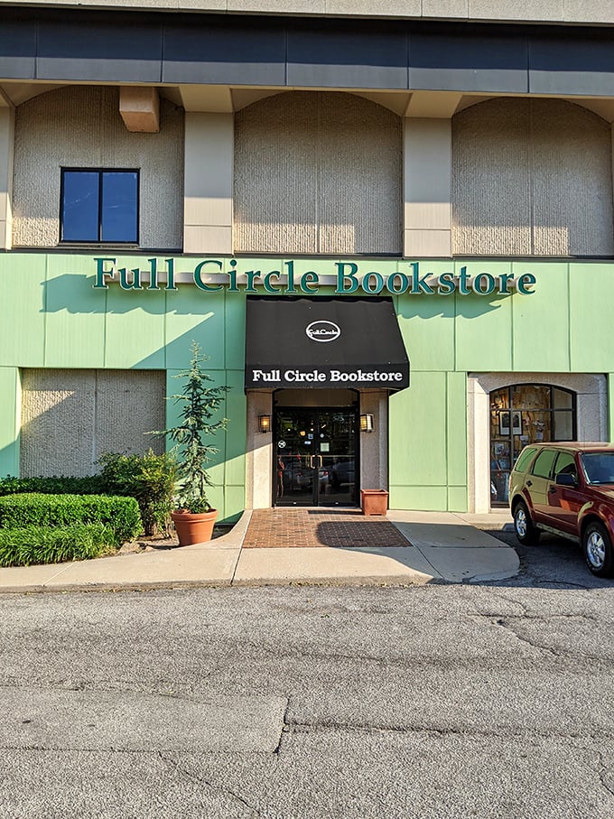 The distinctive green facade of Full Circle Bookstore welcomes bibliophiles with a chalk-written "Welcome" that feels like a literary hug.