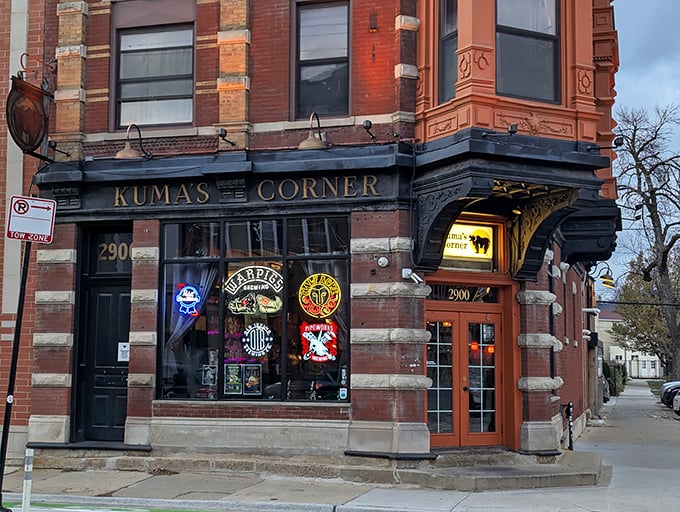 Kuma's Corner stands proudly at Belmont Avenue, its vintage brick exterior and metal band logos promising a burger experience that's anything but ordinary.