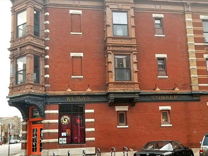 Kuma's Corner stands proudly at Belmont Avenue, its vintage brick exterior and metal band logos promising a burger experience that's anything but ordinary.