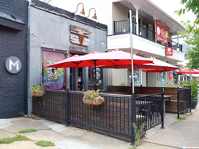 The unassuming exterior of Jack Brown's hides a burger paradise within. Those red umbrellas practically whisper, "Psst, deliciousness happens here."