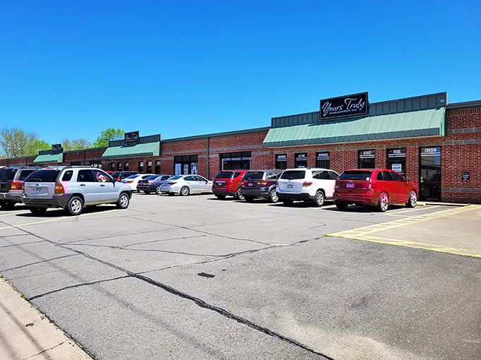 The unassuming brick exterior of Yours Truly Consignment belies the wonderland of treasures waiting inside. Like a speakeasy for bargain hunters!