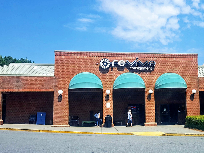 The brick fa&ccedil;ade and teal awnings of Revive Consignment stand like a beacon of bargain-hunting hope in Woodstock, inviting treasure-seekers to step inside and discover.