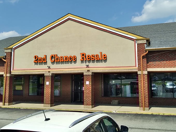 The bright red signage of 2nd Chance Resale beckons like a lighthouse for bargain hunters navigating the sea of retail sameness.