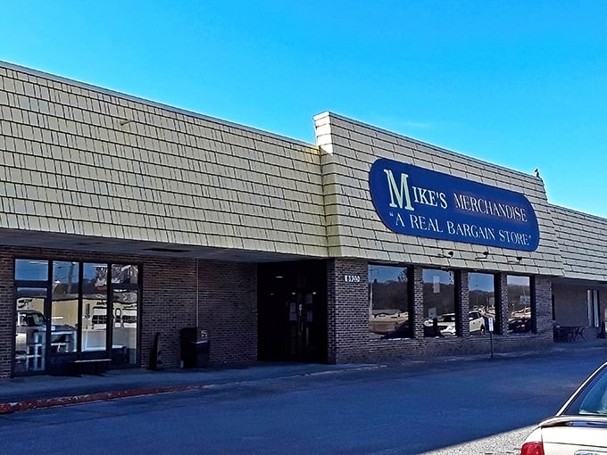 The unassuming yellow facade of Mike's Merchandise promises what the sign boldly declares: "A REAL BARGAIN STORE." Understatement of the century!