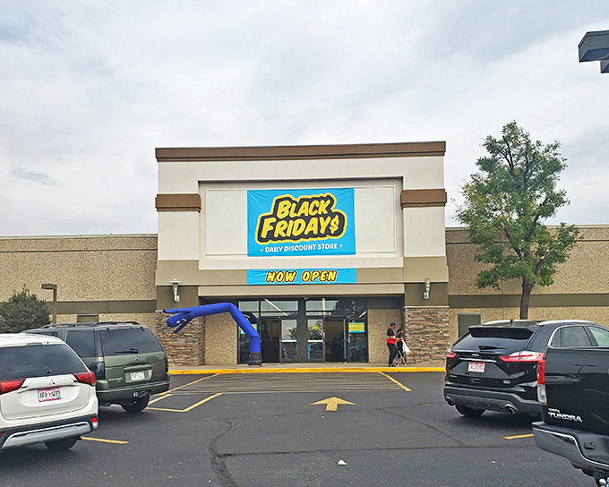 The bright yellow sign of Black Fridays beckons like a retail lighthouse, promising treasure hunters daily discounts in Aurora's shopping seascape.