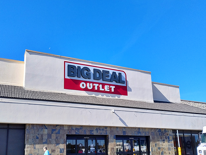 The unassuming exterior of Big Deal Outlet stands like a temple to thriftiness under Idaho's endless blue sky. Retail paradise awaits inside.
