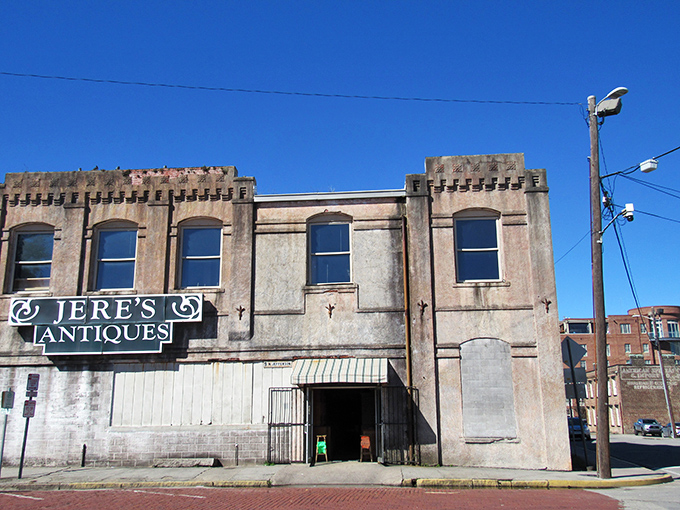 The unassuming castle of wood and wonder. Jere's Antiques' exterior gives little hint of the mahogany motherlode waiting just beyond those doors.