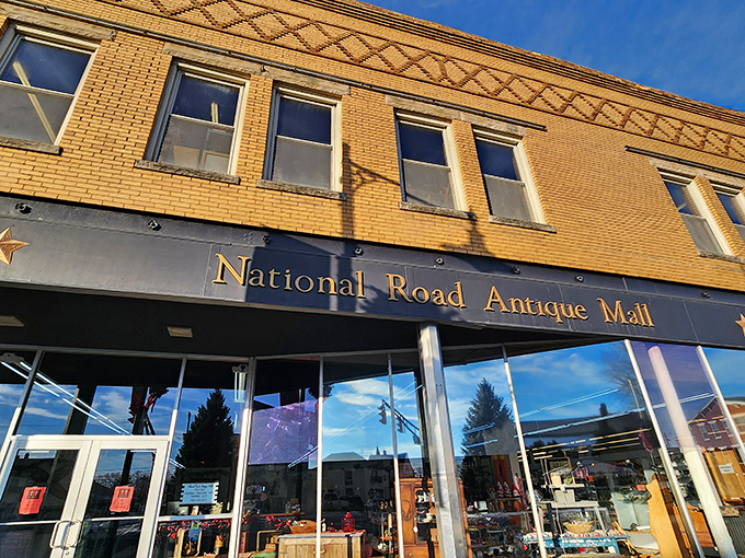 The inviting yellow brick fa&ccedil;ade of National Road Antique Mall beckons treasure hunters with the promise of discoveries waiting just beyond those gleaming windows.