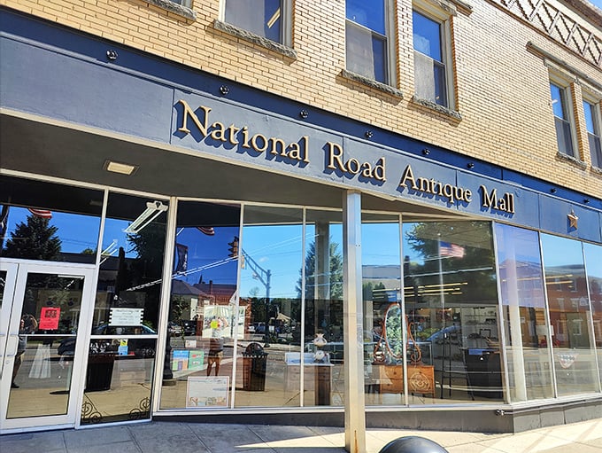 The inviting yellow brick fa&ccedil;ade of National Road Antique Mall beckons treasure hunters with the promise of discoveries waiting just beyond those gleaming windows.