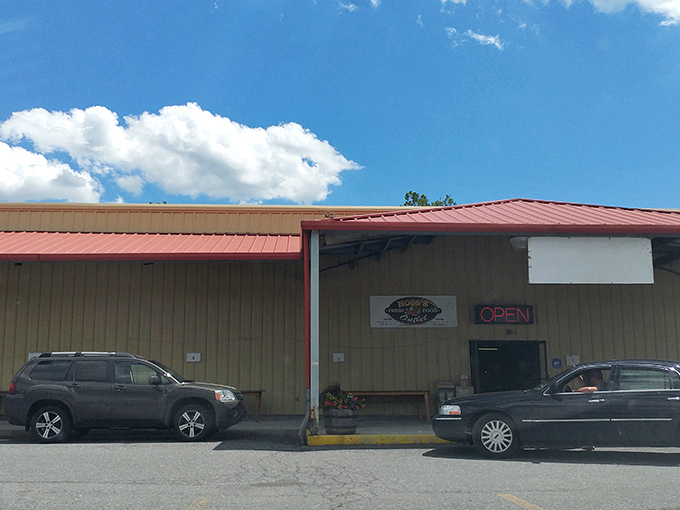 The unassuming orange exterior of Antique Depot stands like a treasure chest waiting to be opened, with storm clouds adding dramatic flair to your bargain-hunting adventure.