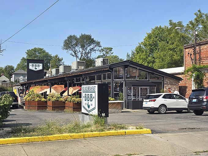 The rooster stands guard outside BBB like a breakfast bouncer, promising only the worthy shall pass into pancake paradise.
