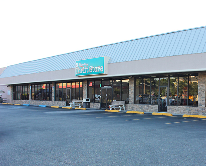The blue-roofed bargain palace beckons like a retail oasis in the Florida heat. This unassuming exterior houses treasures that would make any antique roadshow appraiser sweat with excitement.