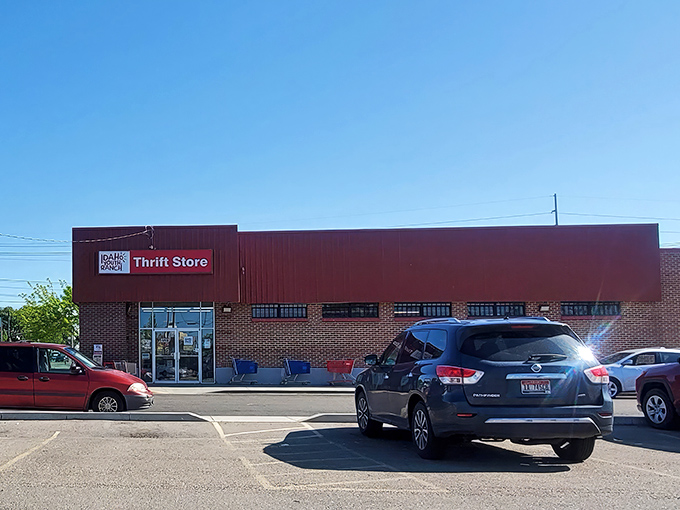 The iconic red exterior of Idaho Youth Ranch Thrift Store stands as a beacon of bargain-hunting possibilities in Meridian. 